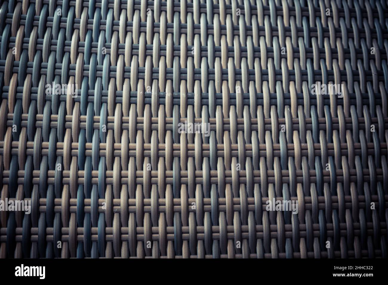 Synthetic rattan texture weaving background as used on outdoor garden ...