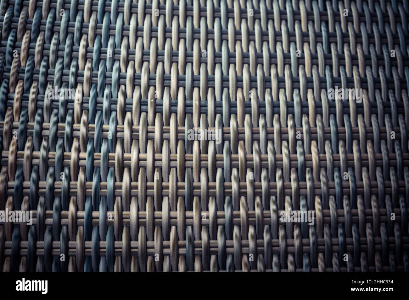 Synthetic rattan texture weaving background as used on outdoor garden ...