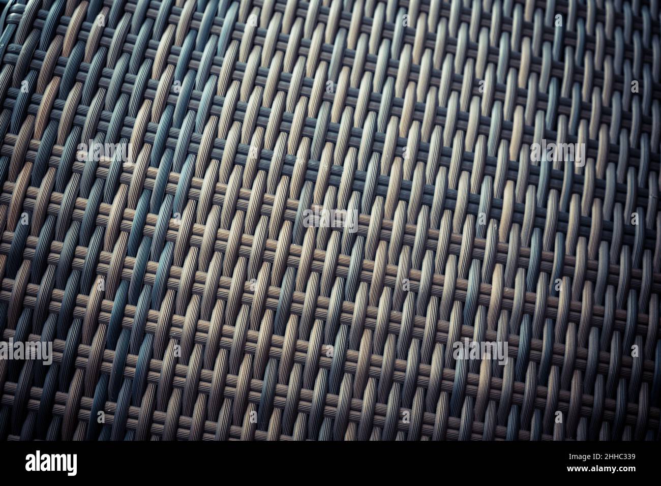 Synthetic rattan texture weaving background as used on outdoor garden ...