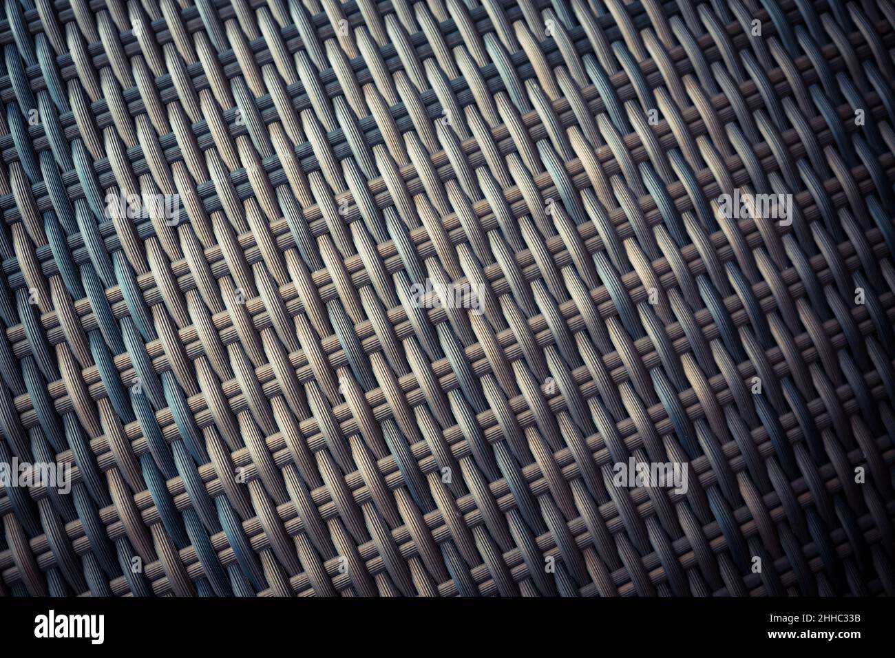 Synthetic rattan texture weaving background as used on outdoor garden ...