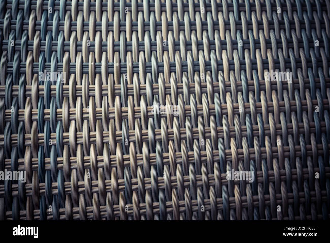 Synthetic rattan texture weaving background as used on outdoor garden ...