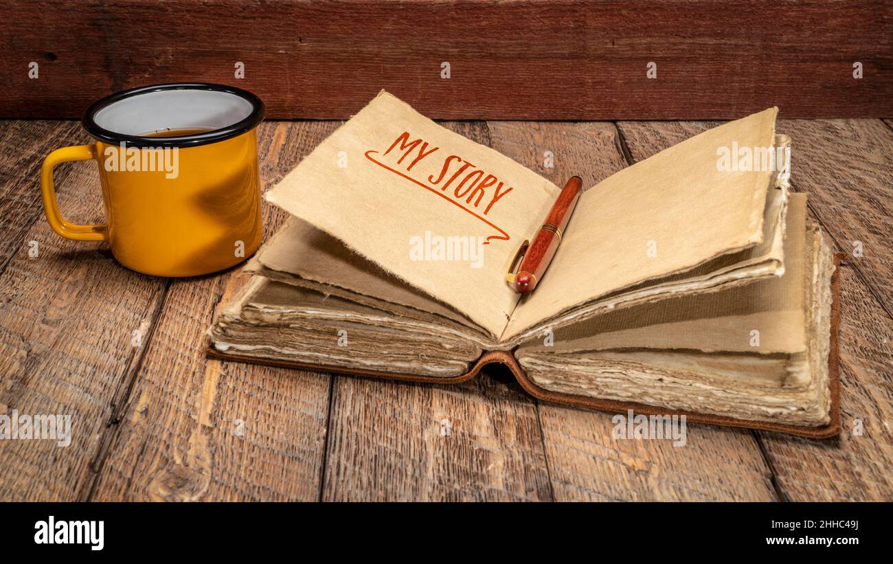 my story - handwriting in a retro leather-bound journal with decked ...