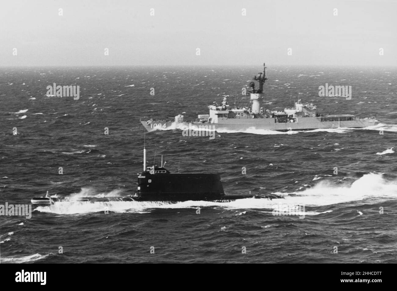 Soviet Golf II-class submarine and USS Pharris (FF-1094) underway off ...