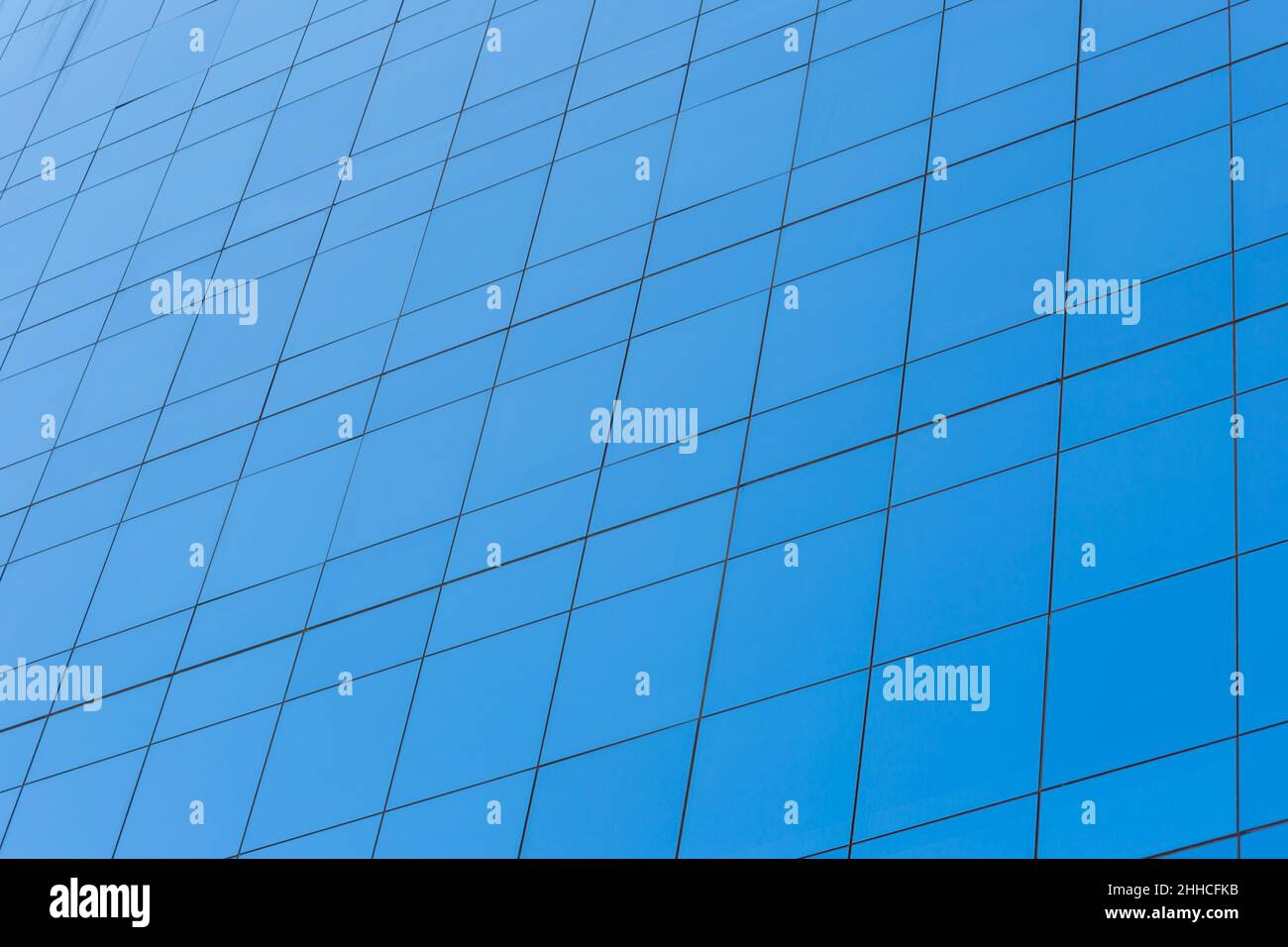 Modern office building with blue glass windows background Stock Photo ...