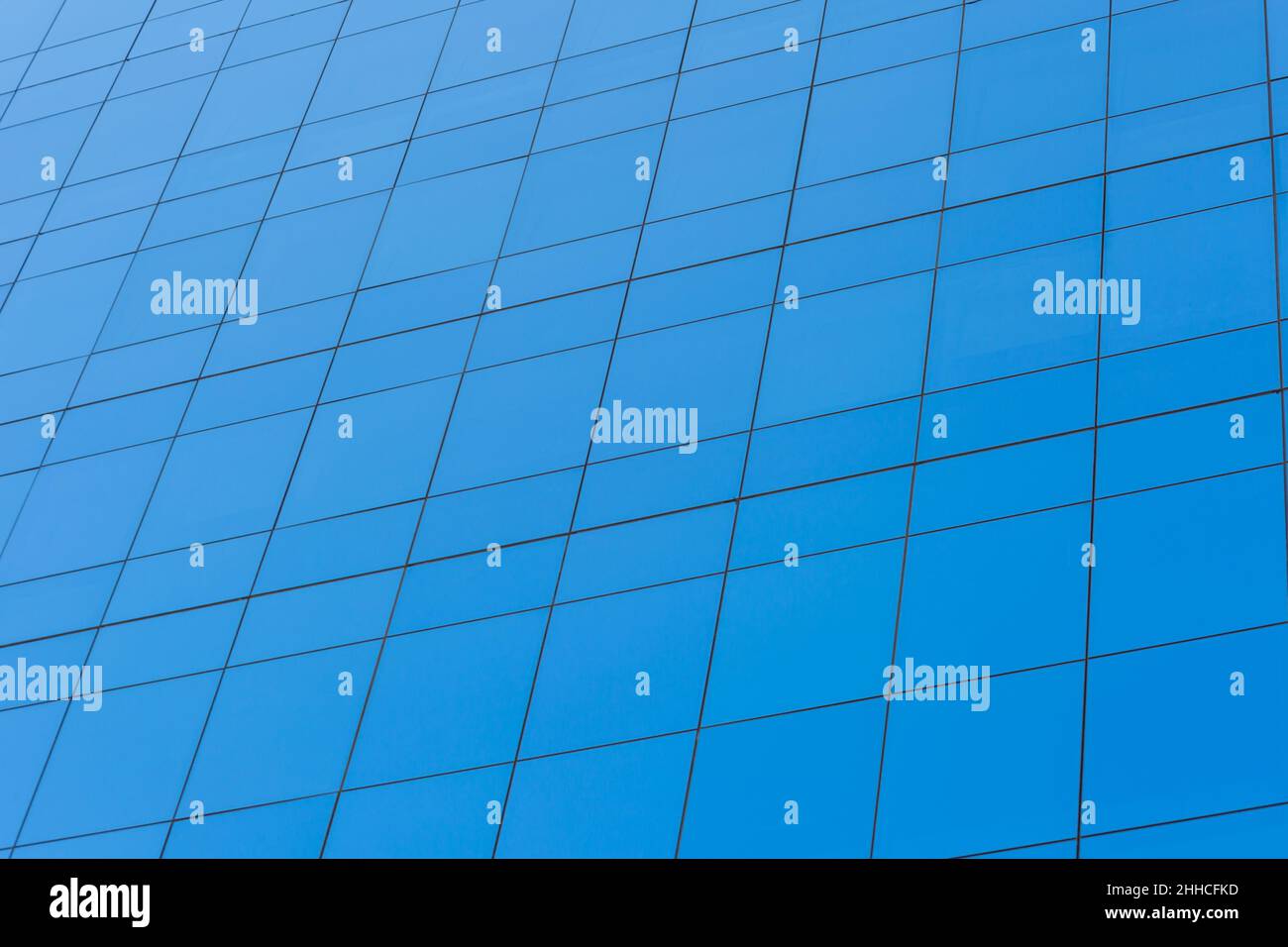 Modern office building with blue glass windows background Stock Photo ...