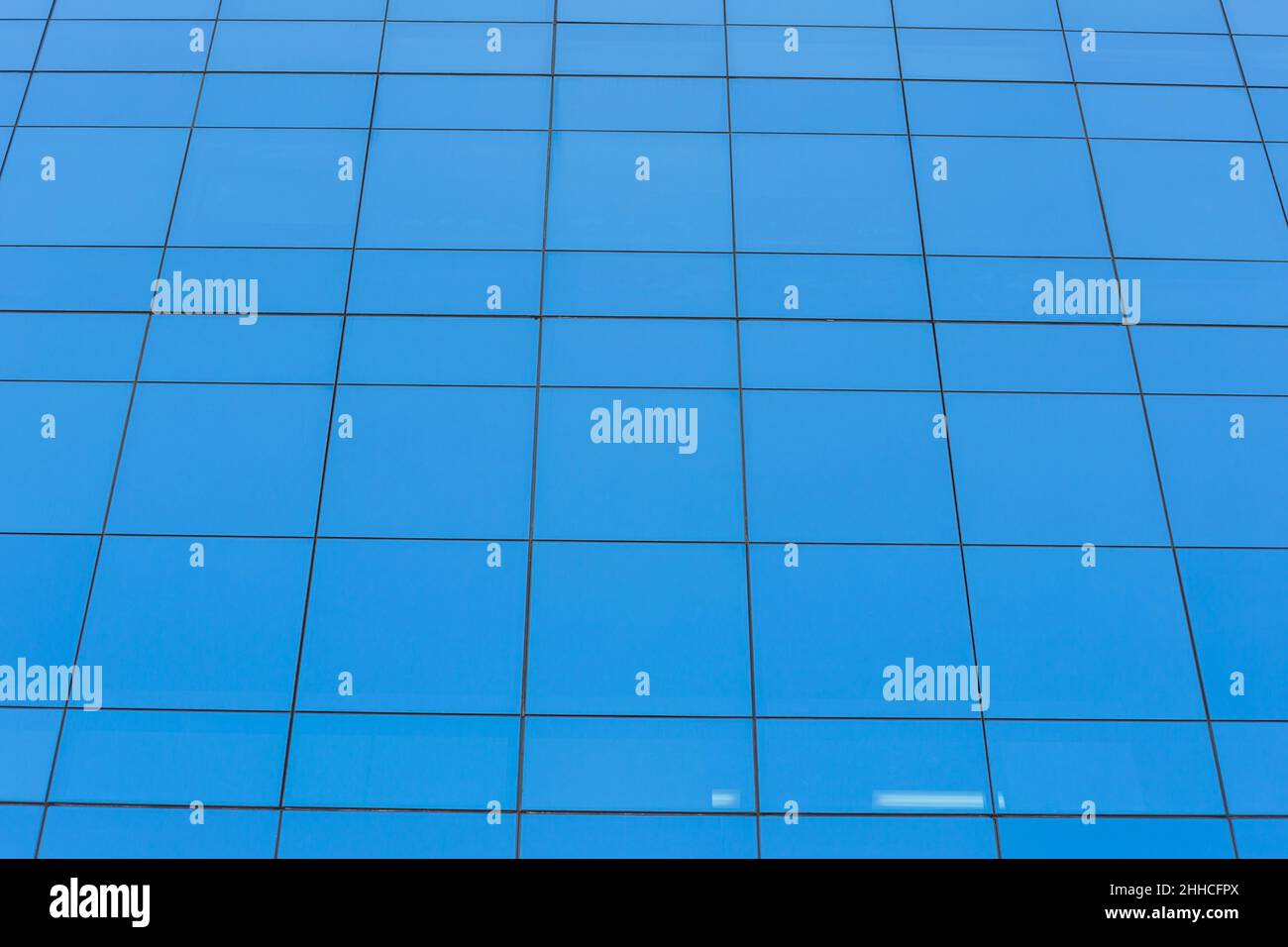 Modern office building with blue glass windows background Stock Photo ...