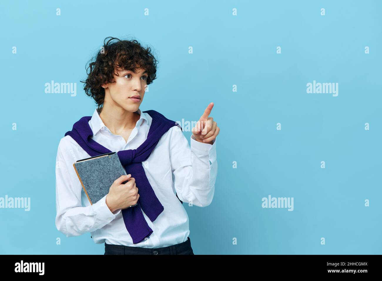 man with a notepad in a sweater shirt on the shoulders cropped view ...