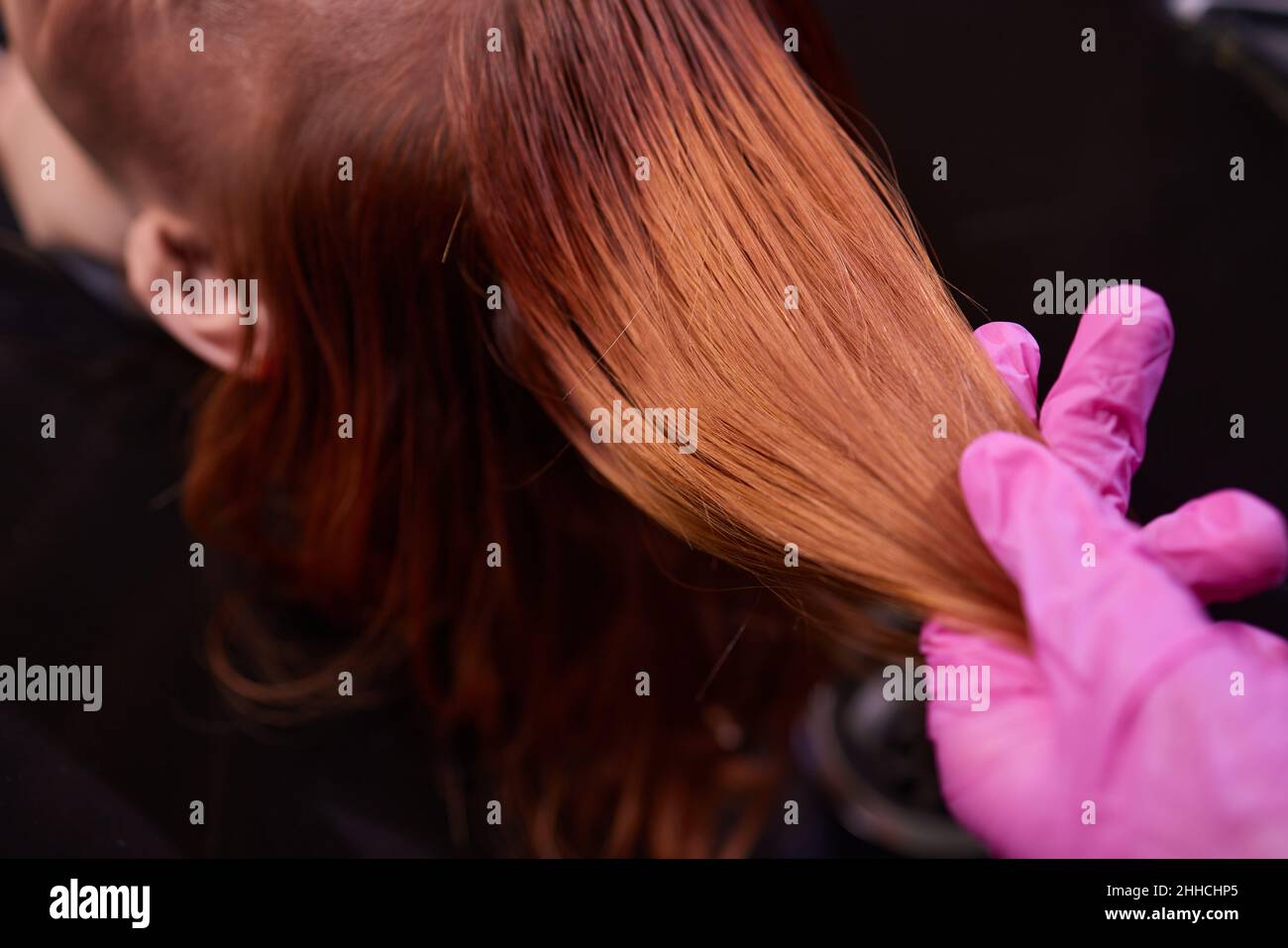 Hairdresser in beauty salon washes his client hair, before procedure of ...