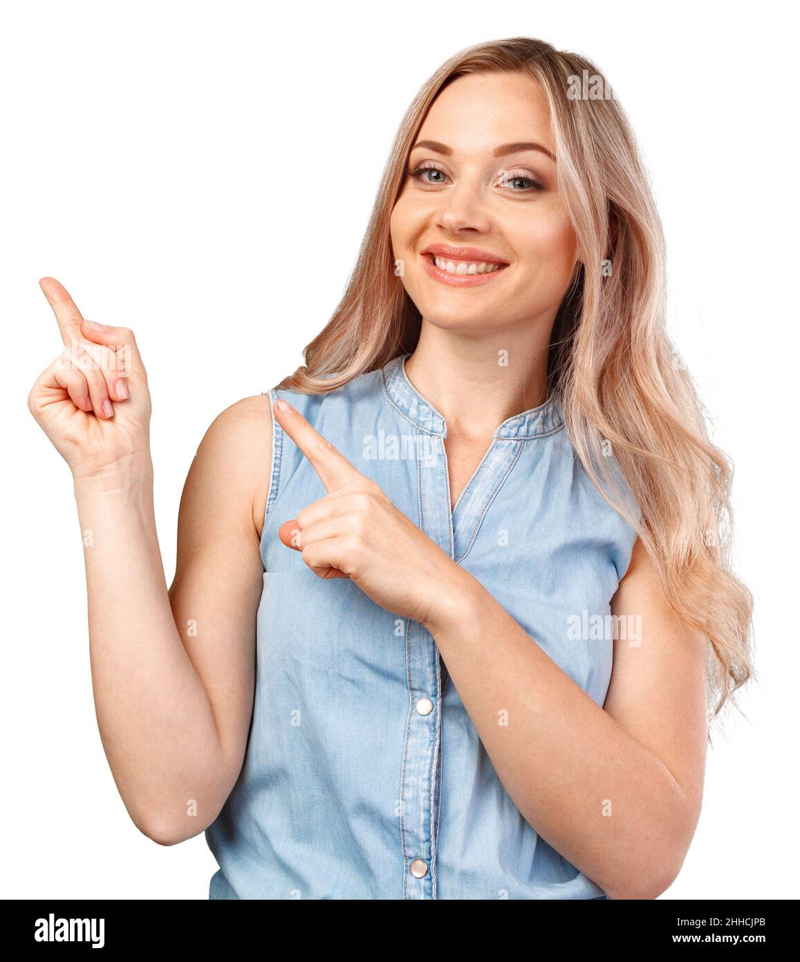 Young woman pointing at your product isolated on white background Stock ...
