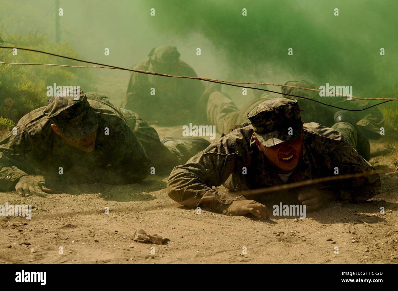 Special Warfare combatant-craft crewman candidates low-crawl under an ...