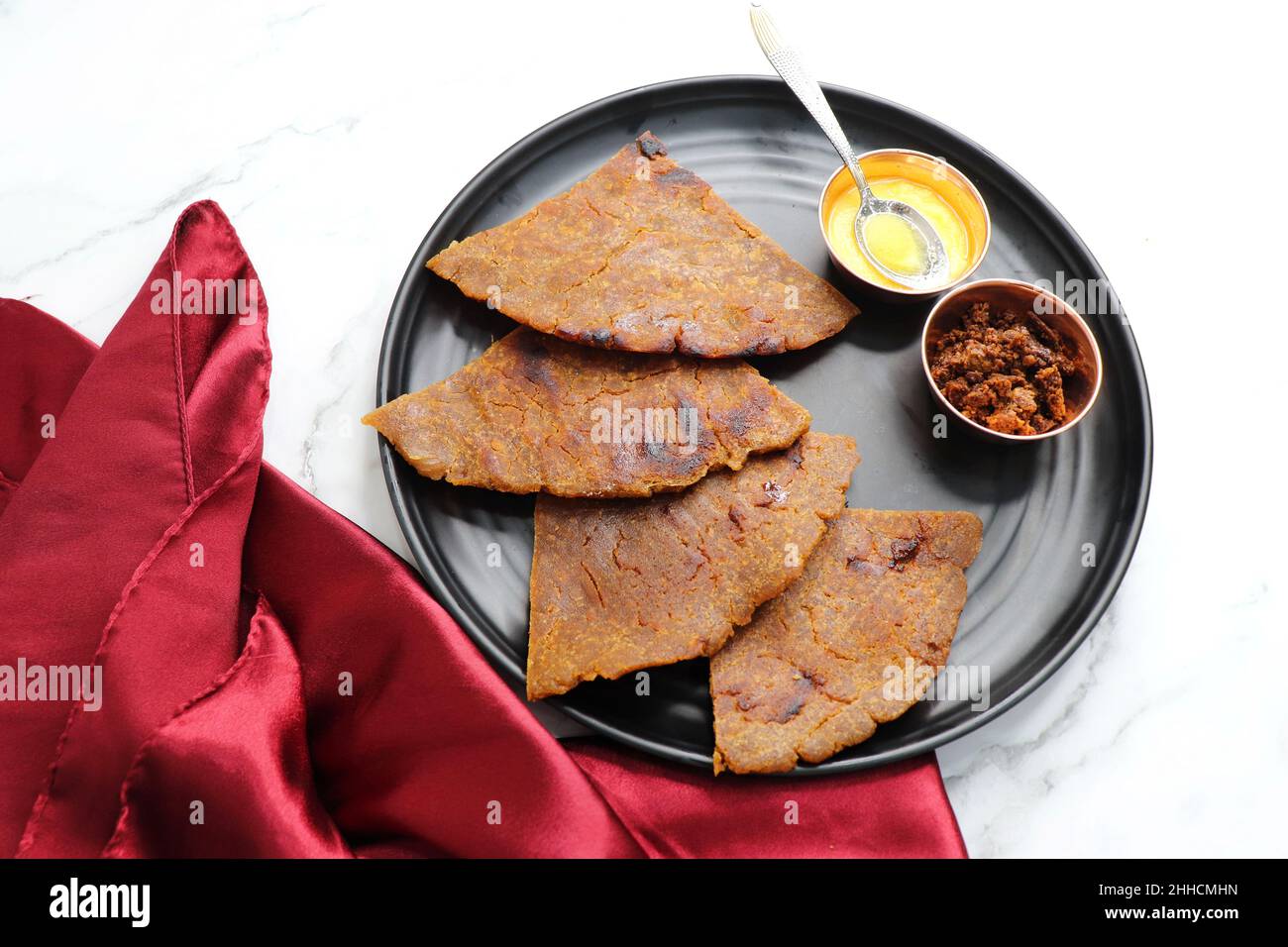 Sweet roti made out of rice flour, jaggery, and ghee. Gud ki roti. gur ...