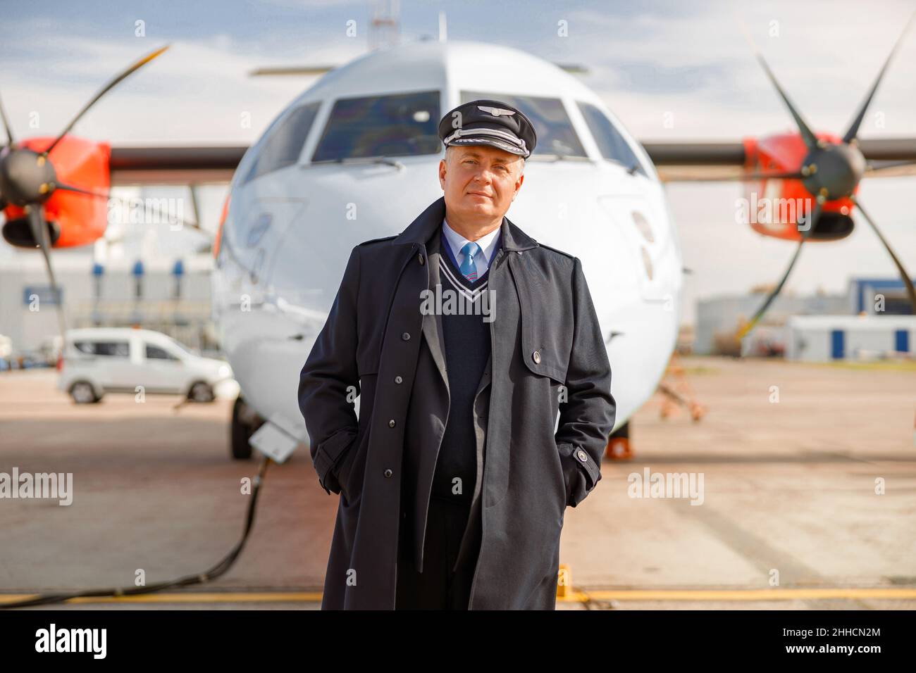 Airline captain in aviation uniform standing outdoors at airport Stock ...