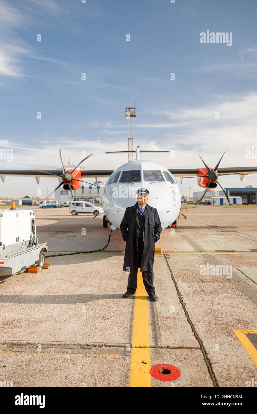 Man airplane pilot standing outdoors at airfield Stock Photo - Alamy