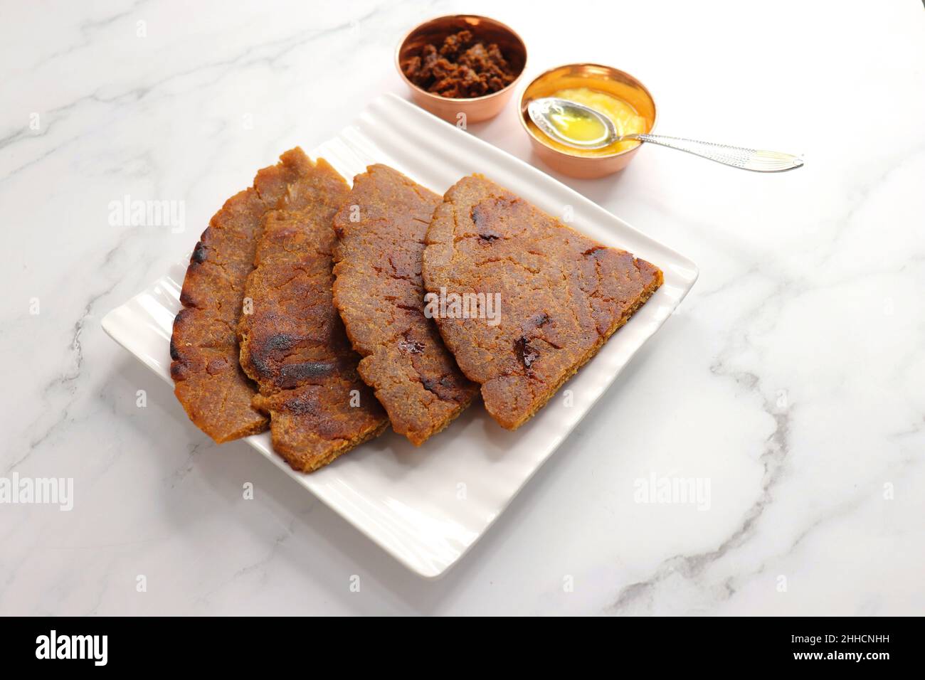 Sweet roti made out of rice flour, jaggery, and ghee. Gud ki roti. gur ...