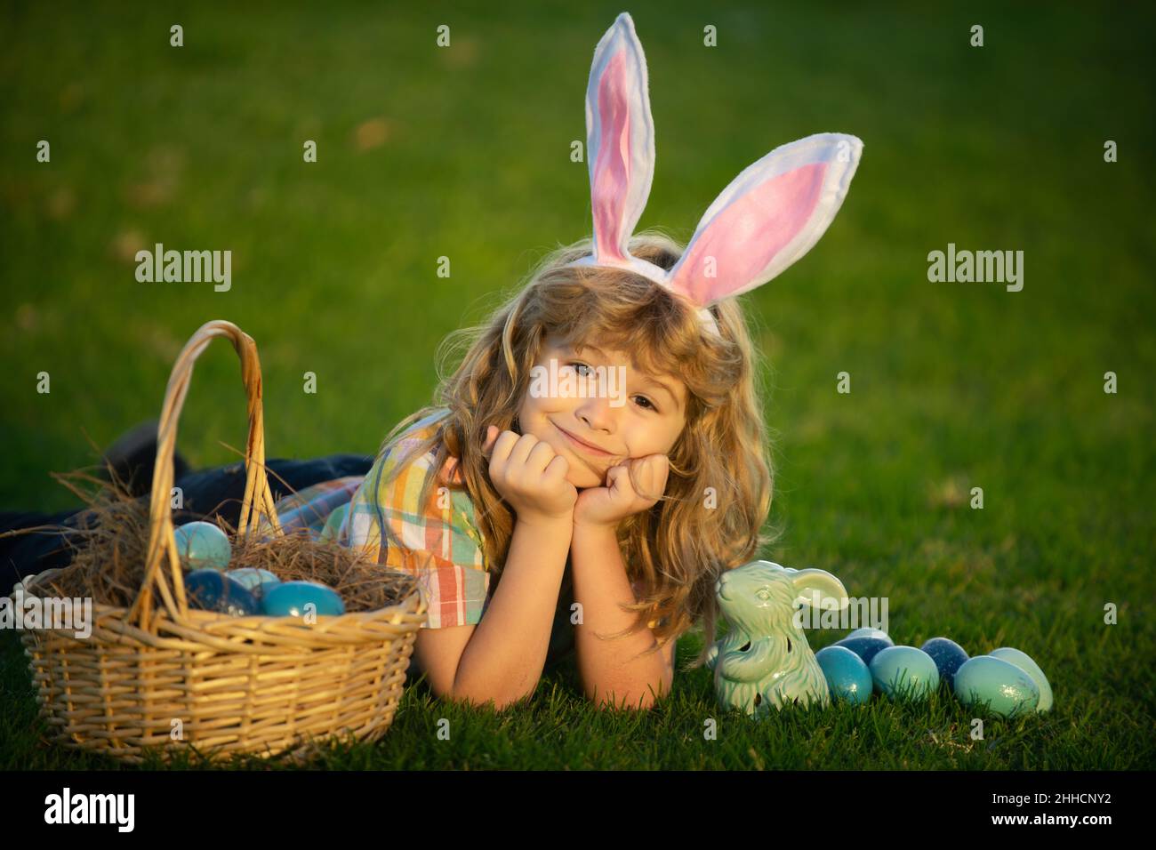 Bunny kids with rabbit bunny ears. Child boy with easter eggs in basket ...