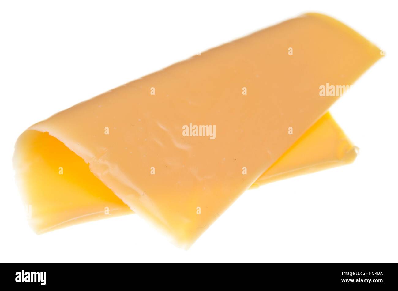 Folded slice of cheese isolated on white background Stock Photo - Alamy