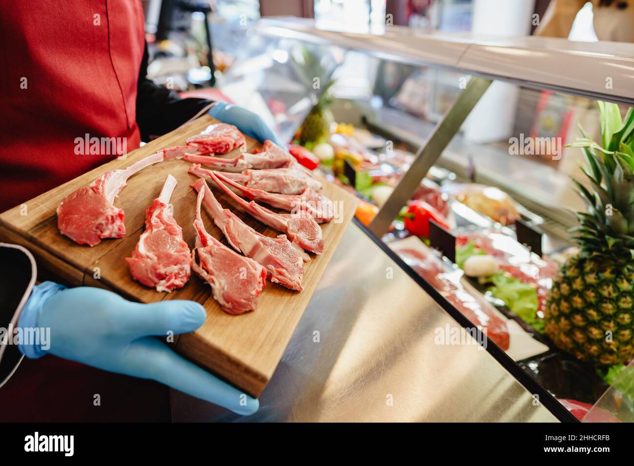 Close up of a butcher setting raw lamb ribs in a butcher shop Stock ...