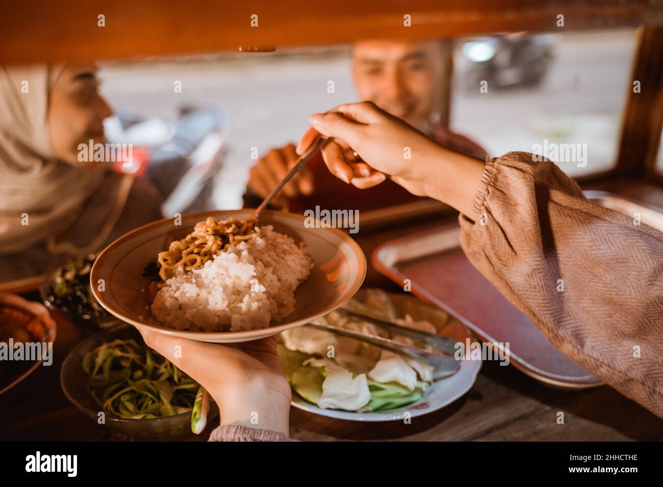 hand taking some food in traditional food stall Stock Photo - Alamy
