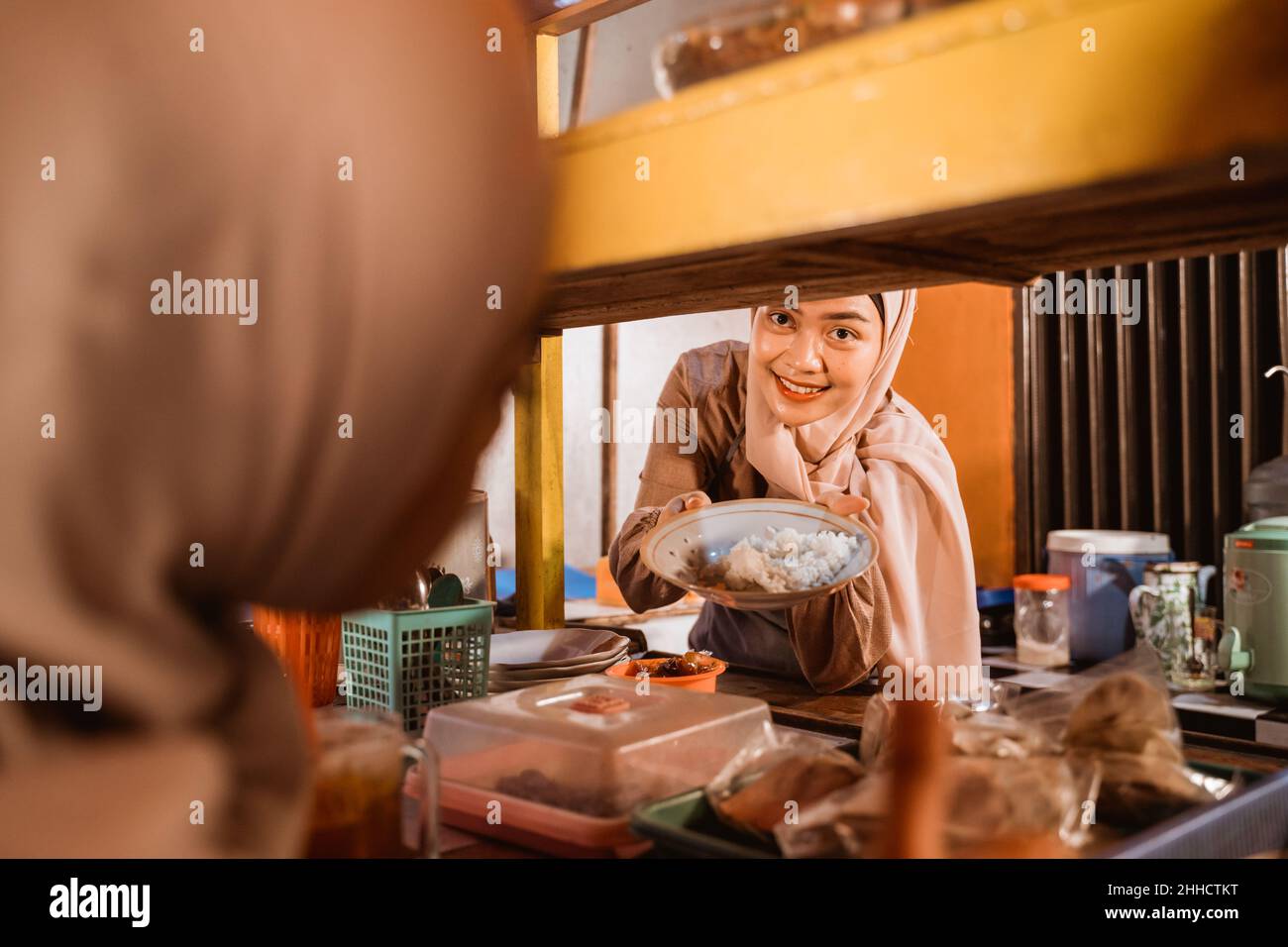 muslim asian woman preparing her food stall Stock Photo - Alamy