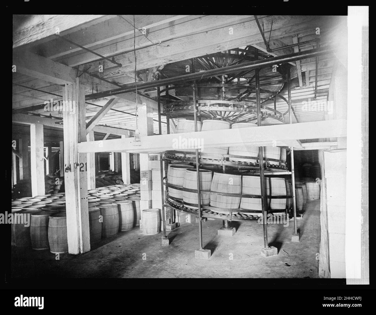 Spiral gravity boiler conveyor for handling barrels and boxes Stock ...