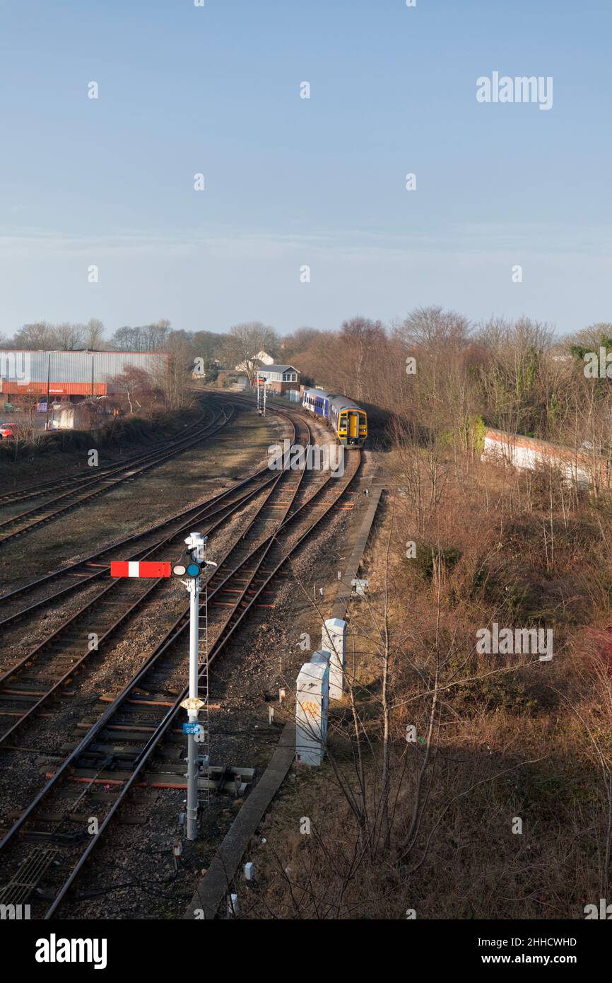 Northern Rail class 158 sprinter train 158795 with mechanical railway signals and the large ...