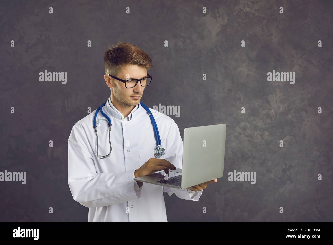 Doctor using stethoscope check young hi-res stock photography and ...