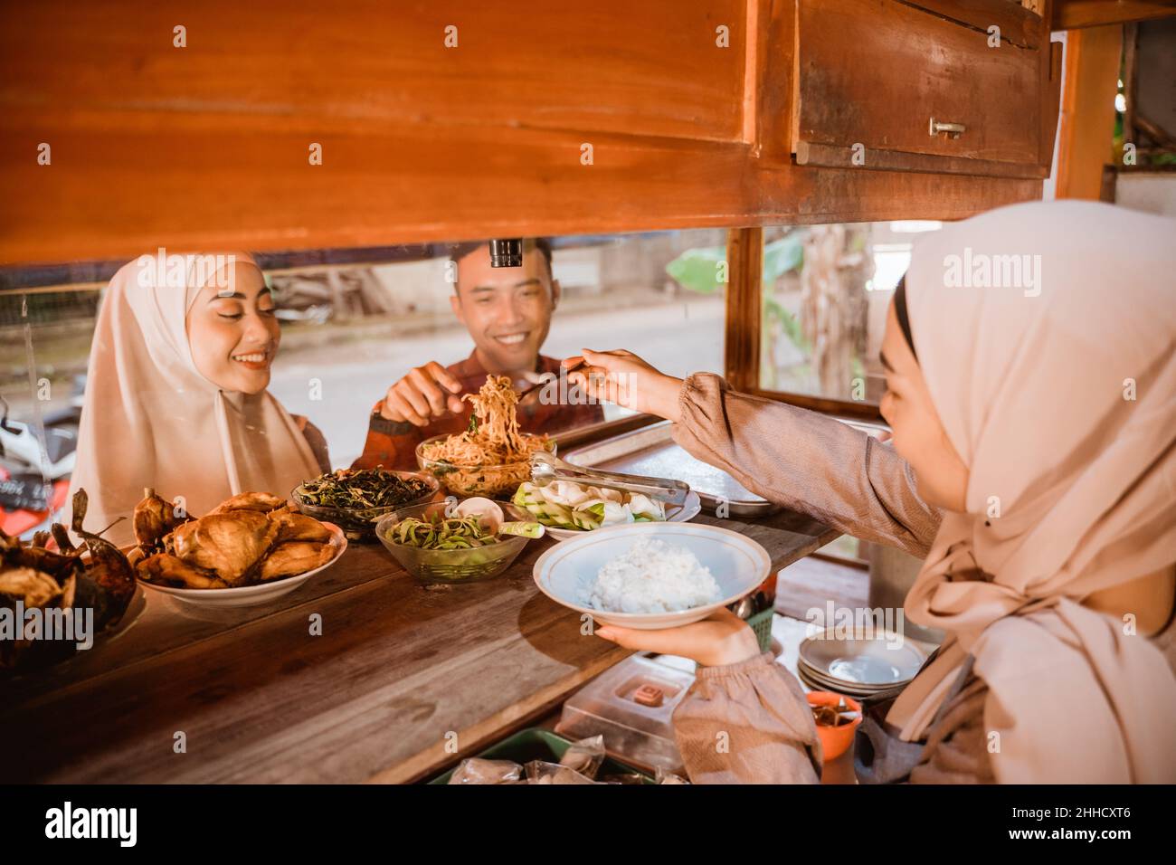 muslim customer buying and choosing food at traditional food stall ...