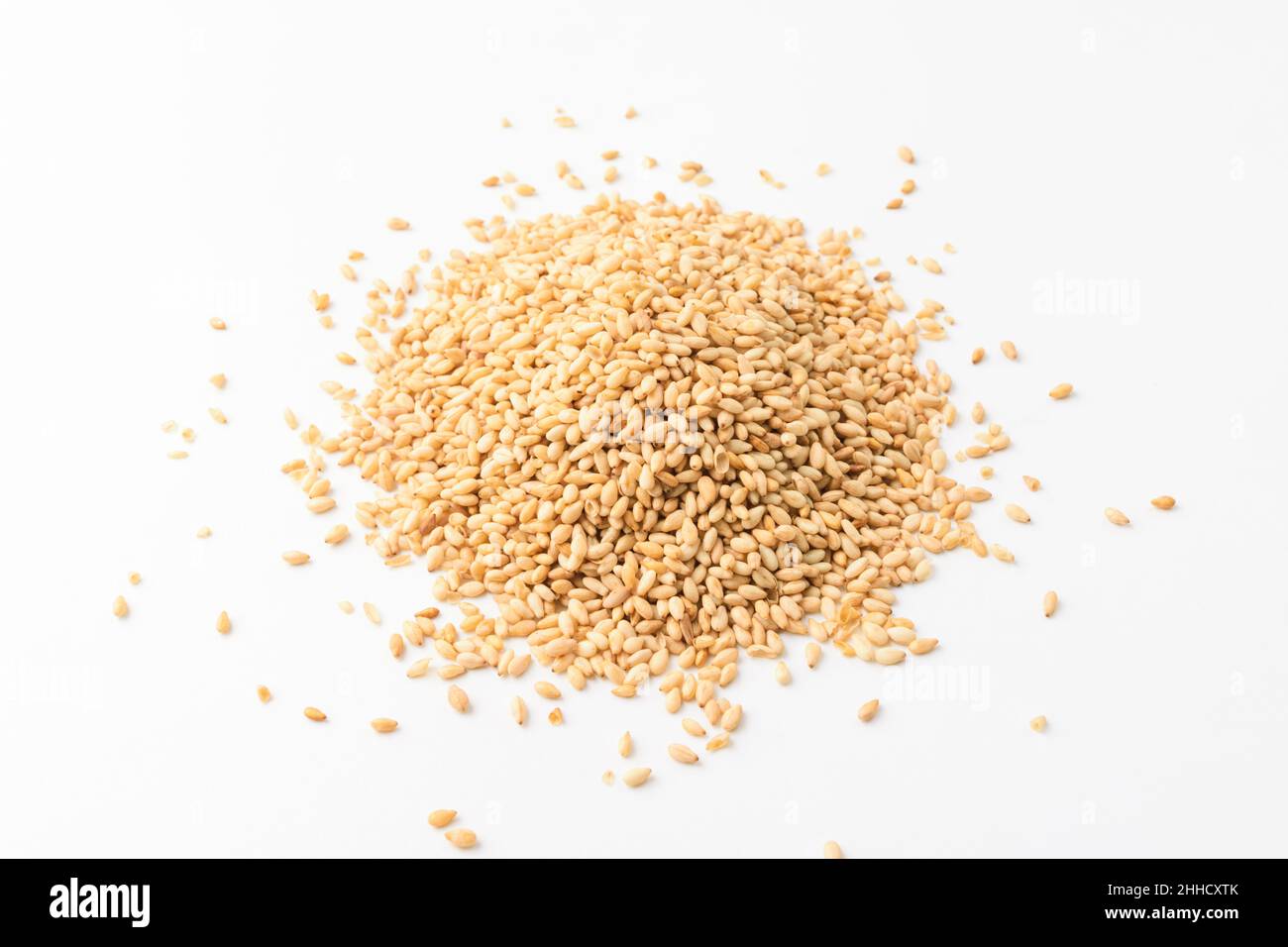 Sesame seeds on white background Stock Photo - Alamy