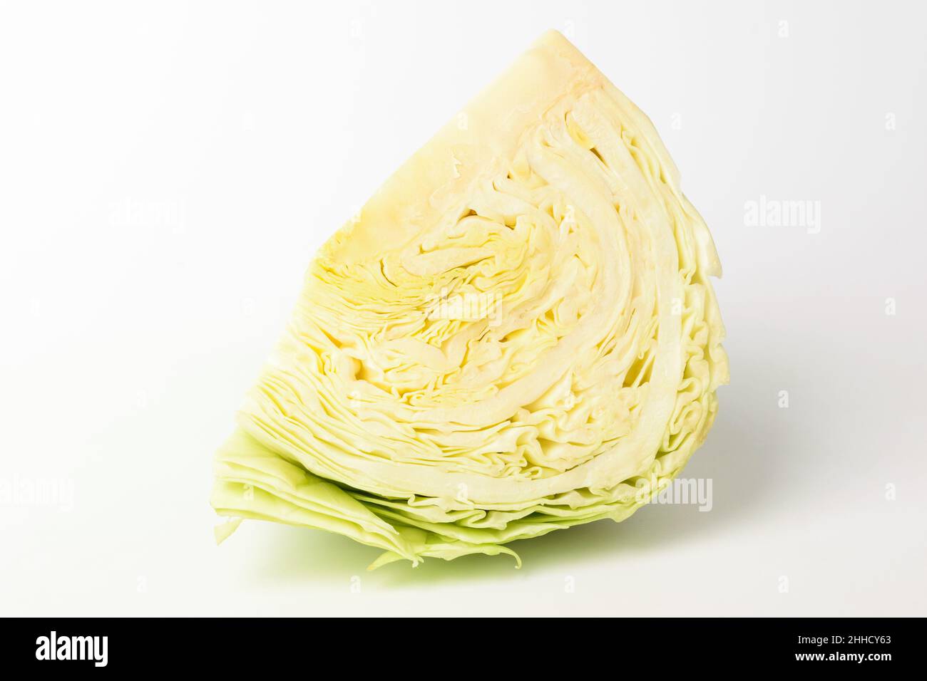Cabbage cut on white background Stock Photo - Alamy