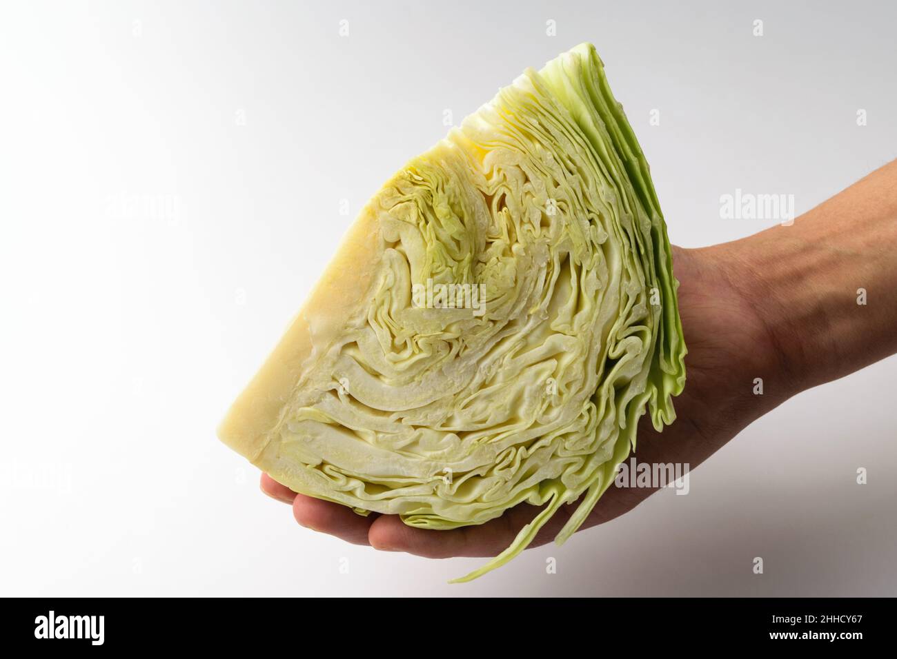 Cabbage cut on white background Stock Photo - Alamy
