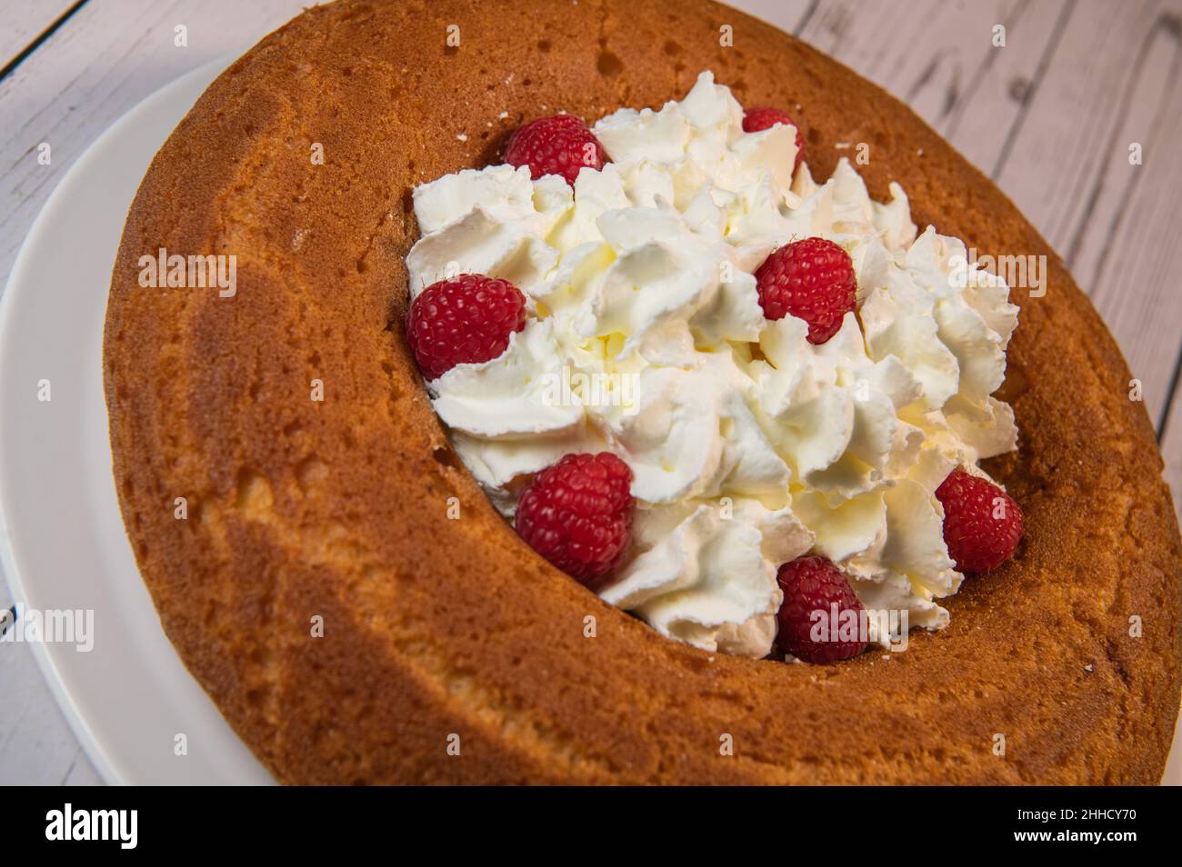Pastry, Traditional Italian rum cake with whipped cream and raspberries ...