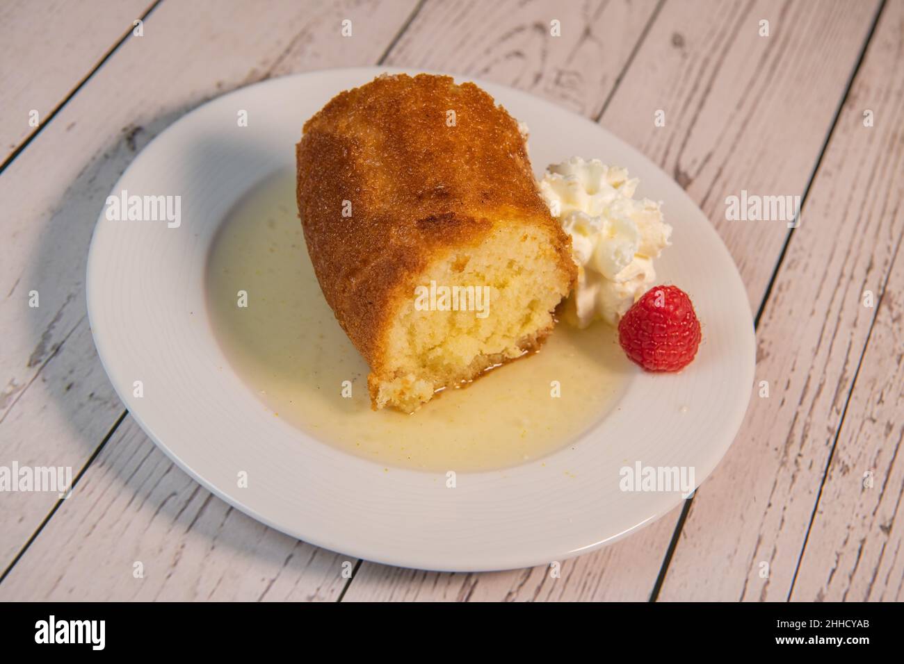Pastry, Traditional Italian rum cake with whipped cream and raspberries ...