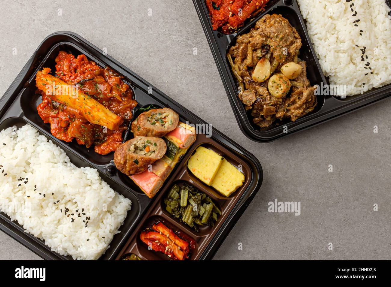 Lunch box with rice, meat and vegetable side dishes Stock Photo - Alamy