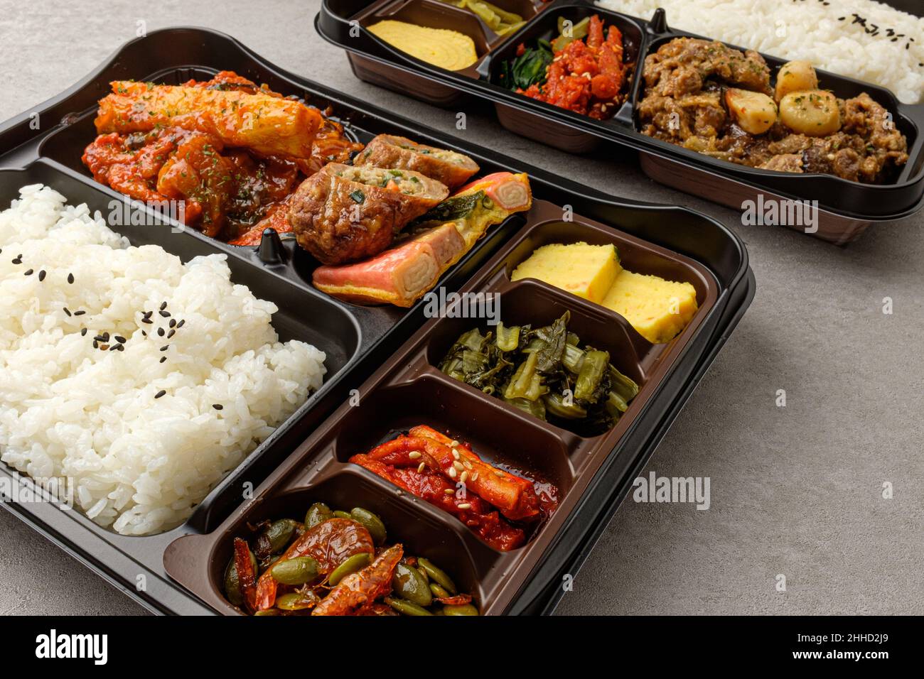 Lunch box with rice, meat and vegetable side dishes Stock Photo - Alamy