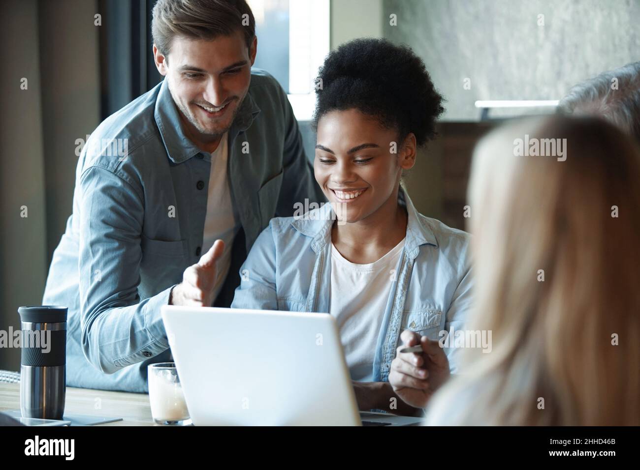 Smiling diverse businesspeople having discussion hi-res stock ...
