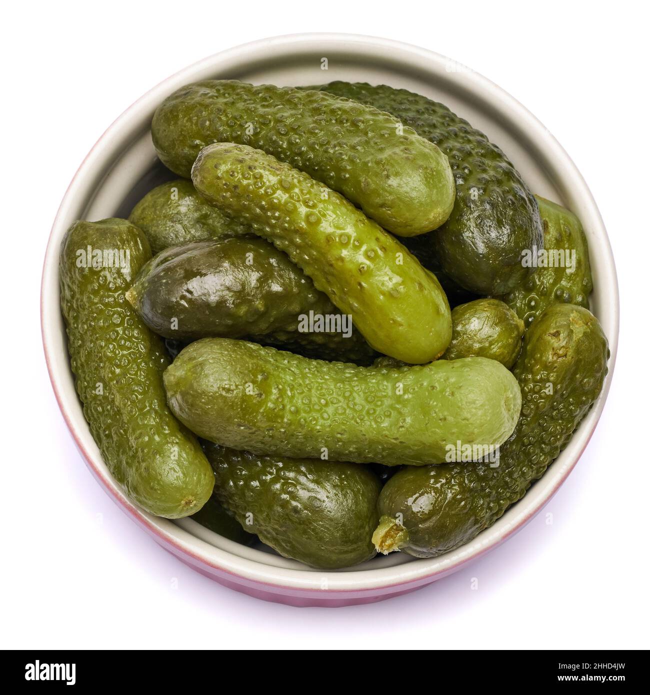 Plate of Tasty canned Whole green cornichons isolated on a white ...