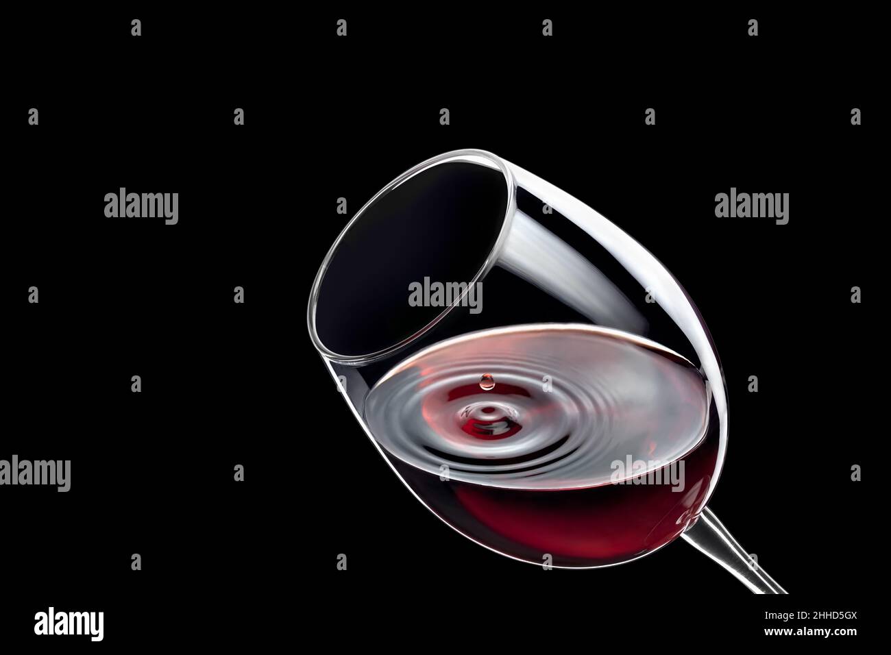 red wine drop falling in glass and created splash Stock Photo - Alamy
