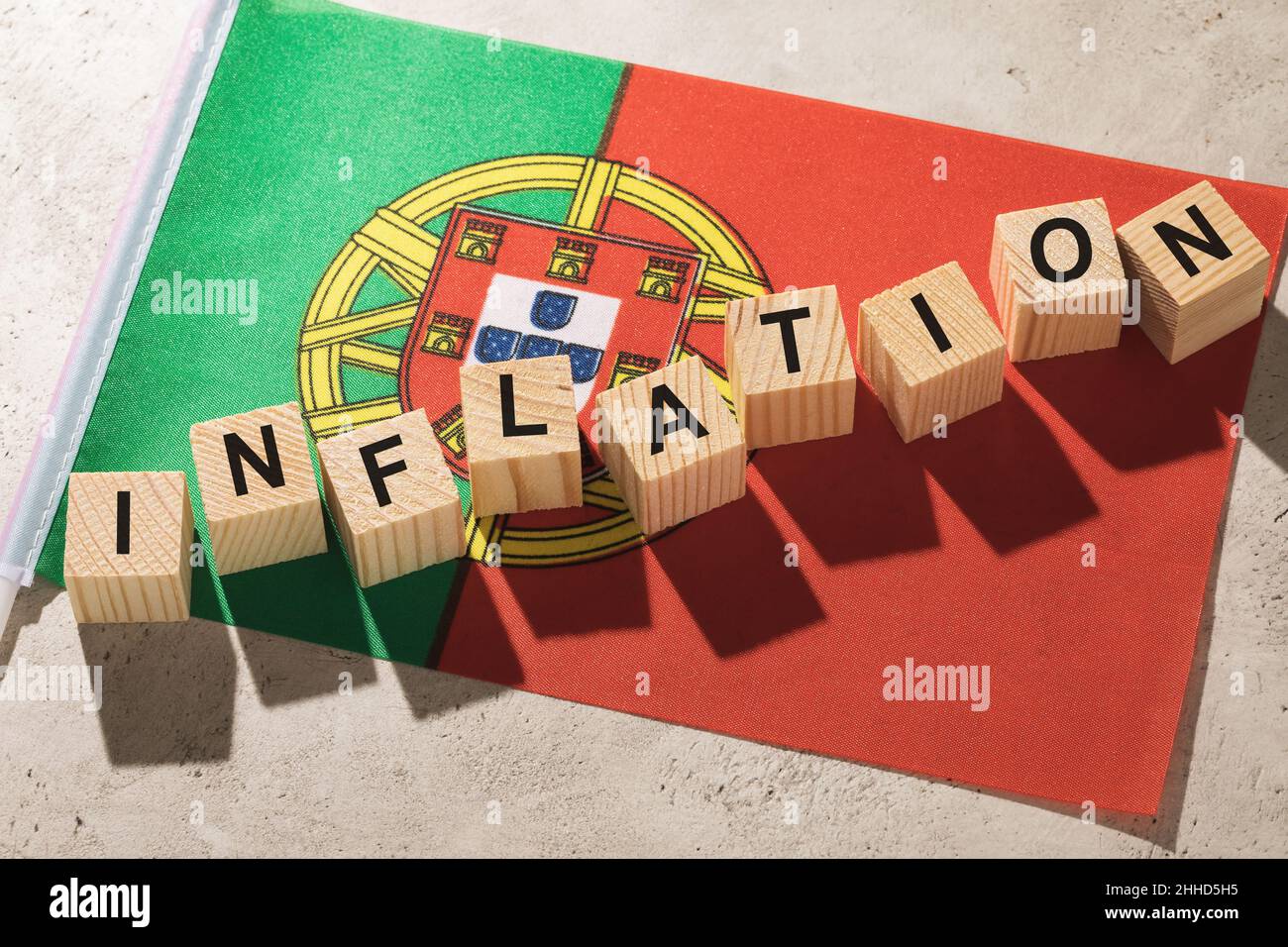 Flag and wooden cubes with text, a concept on the theme of inflation in ...