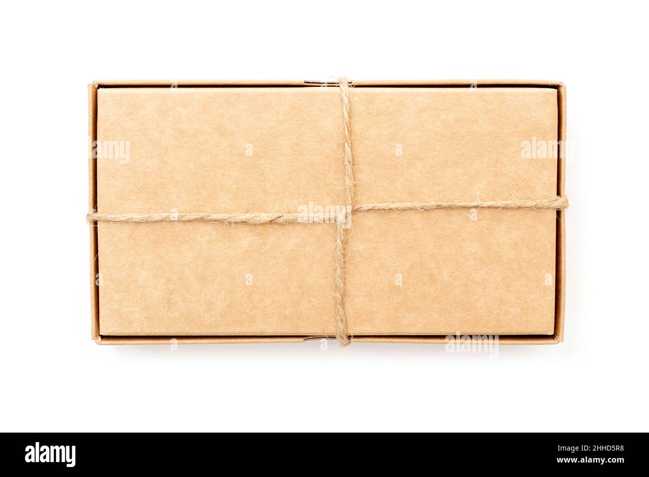 Gift paper box with rope isolated on white Stock Photo - Alamy