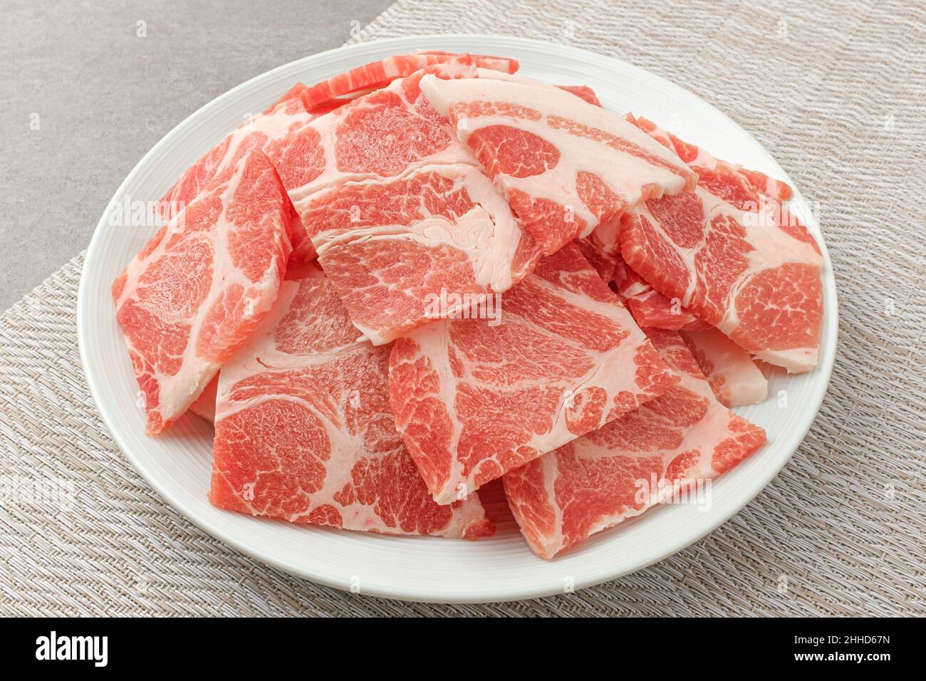 Pork neck meat, thinly sliced into square shapes Stock Photo - Alamy
