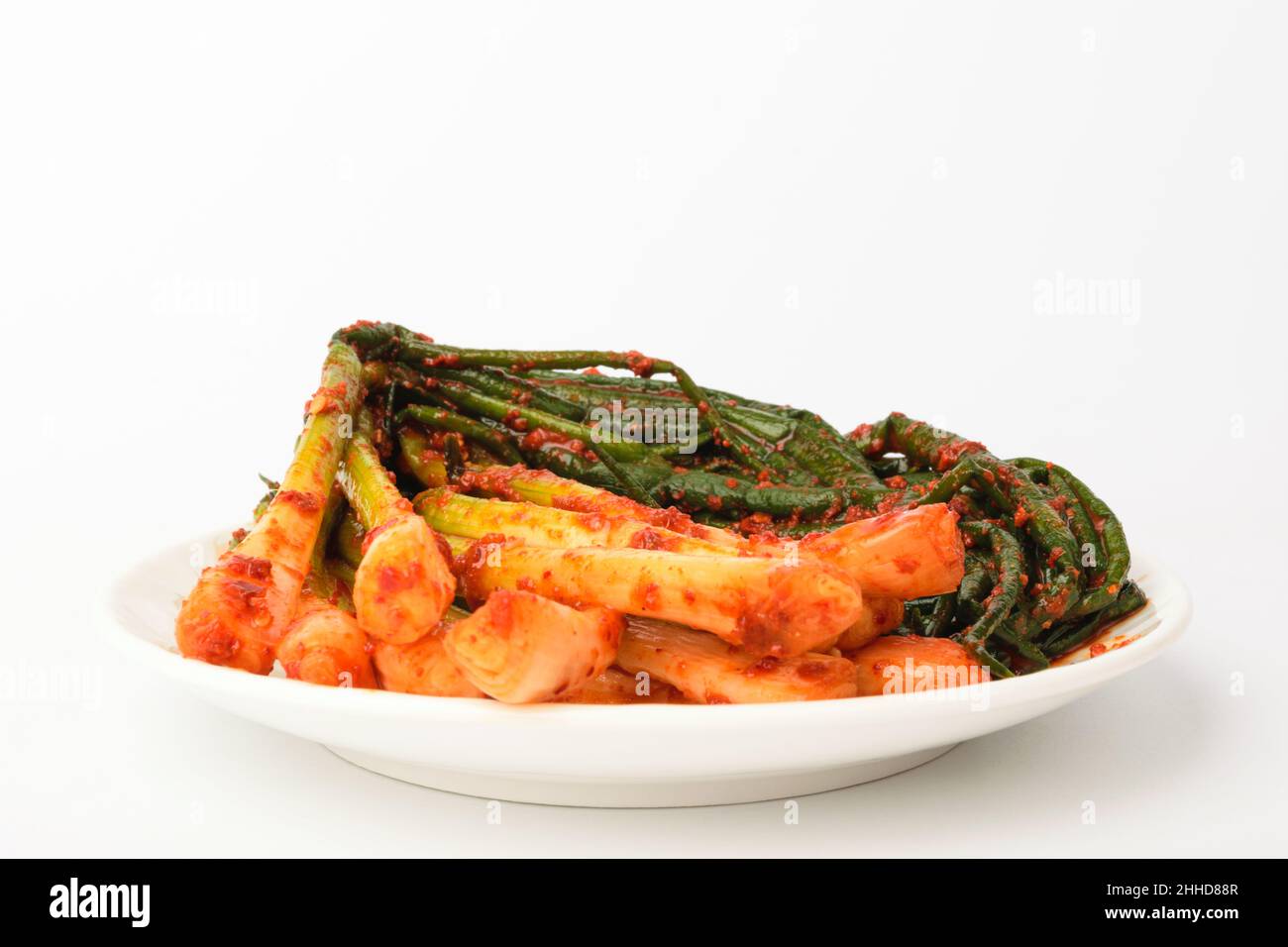 Green onion kimchi on white background Stock Photo - Alamy