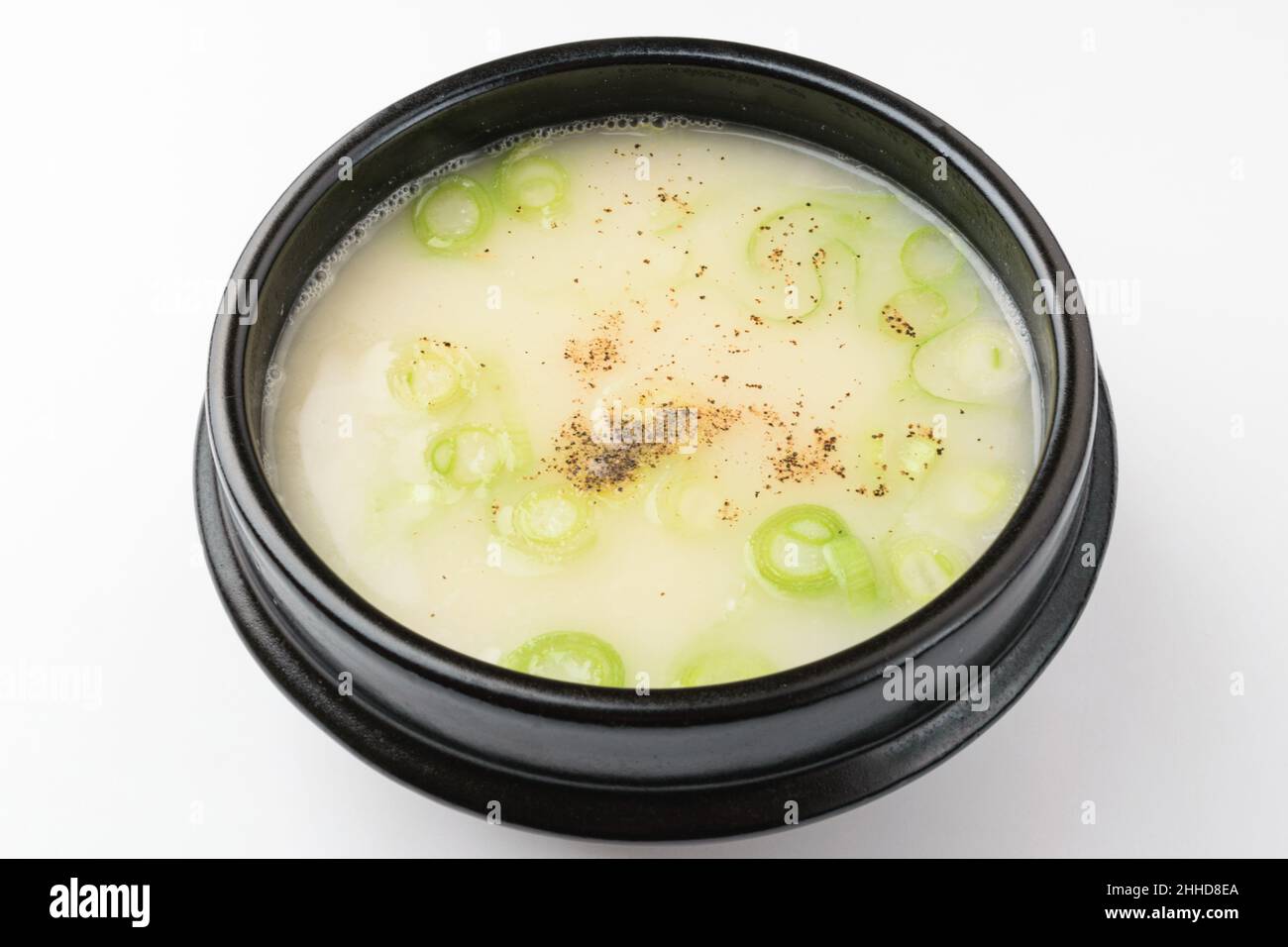 Beef bone broth on a white background Stock Photo - Alamy