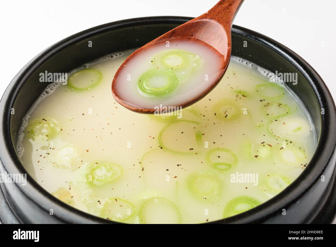 Beef bone broth on a white background Stock Photo - Alamy