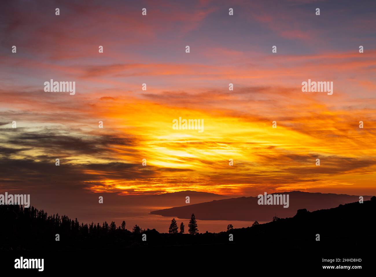 Fiery red sunset behind the islands of El Hierro and La Gomera seen ...