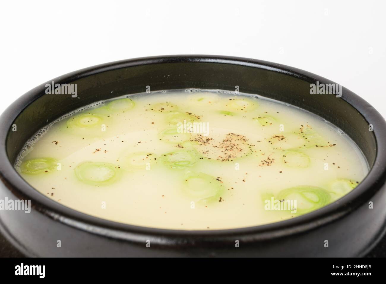 Beef bone broth on a white background Stock Photo - Alamy