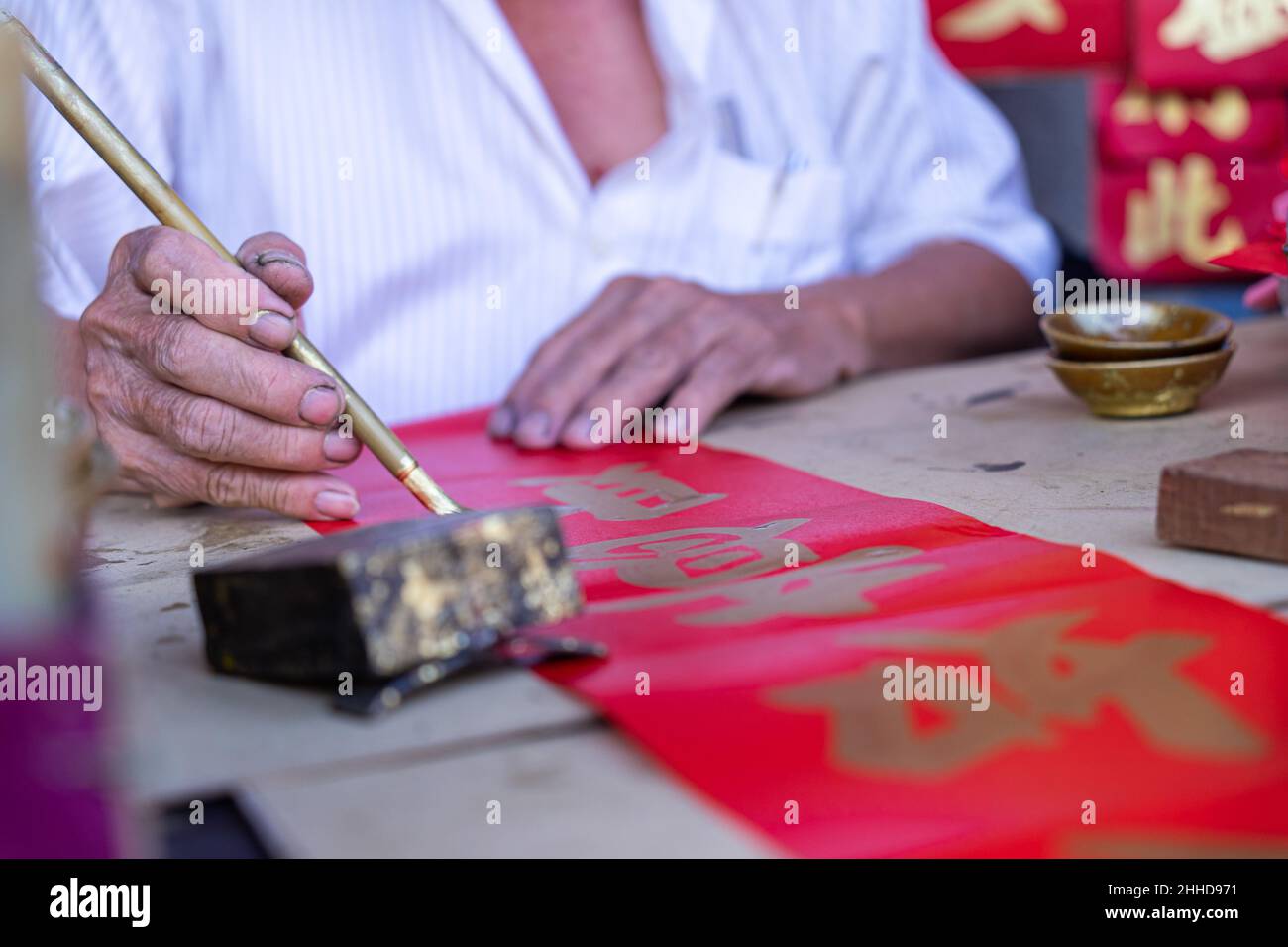 People write Spring Festival couplets with brushes to celebrate Chinese ...