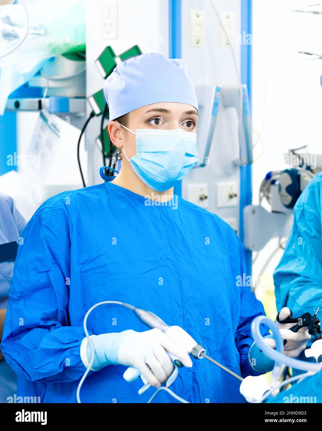 A female surgeon performs a surgical laparoscopic operation using ...