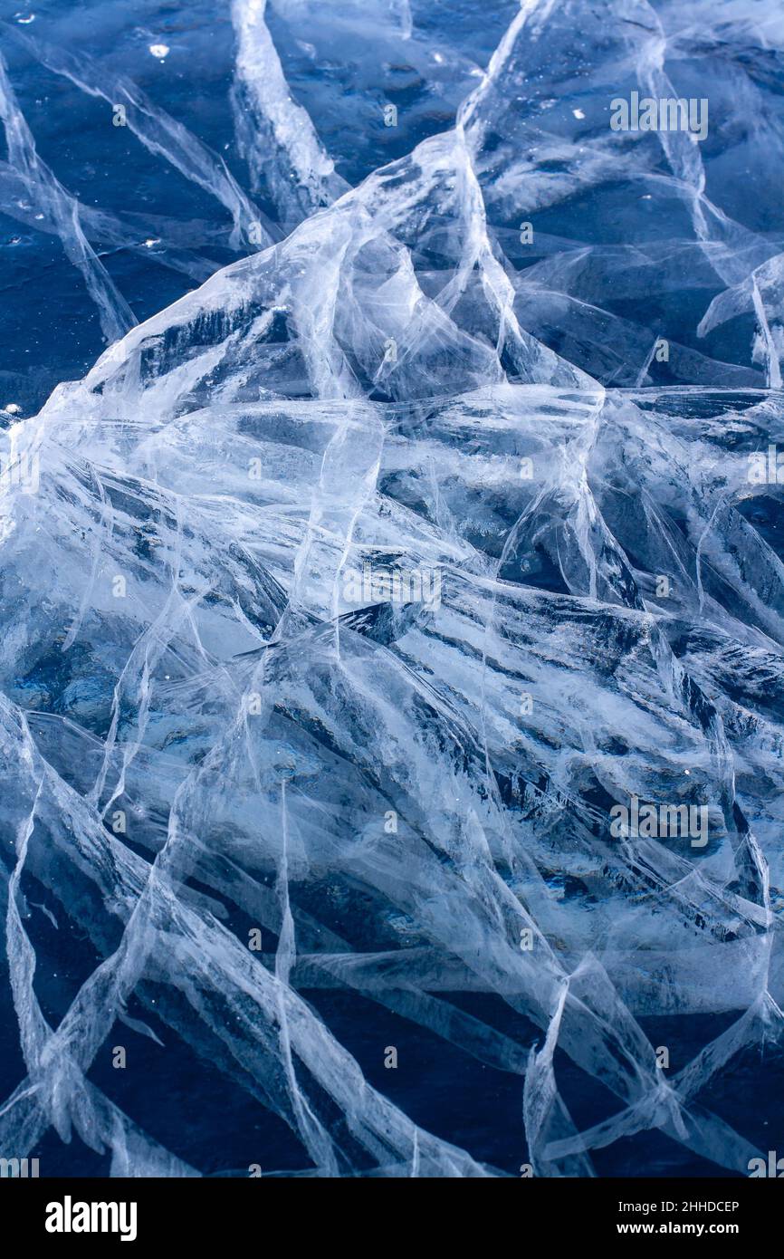 Natural texture of pure ice with cracks. Blue thick ice. Vertical Stock ...