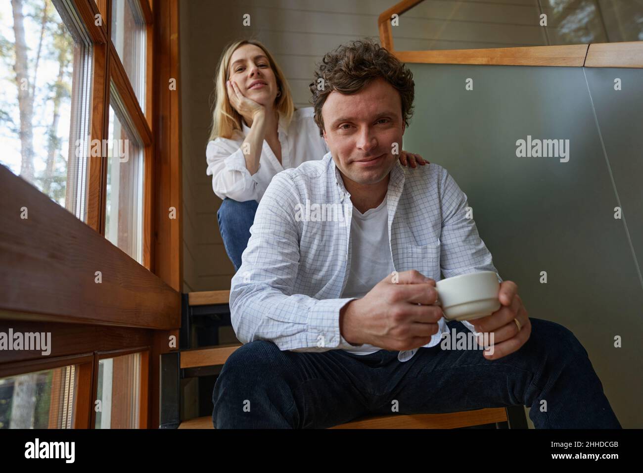 Positive delighted people looking straight at camera Stock Photo - Alamy