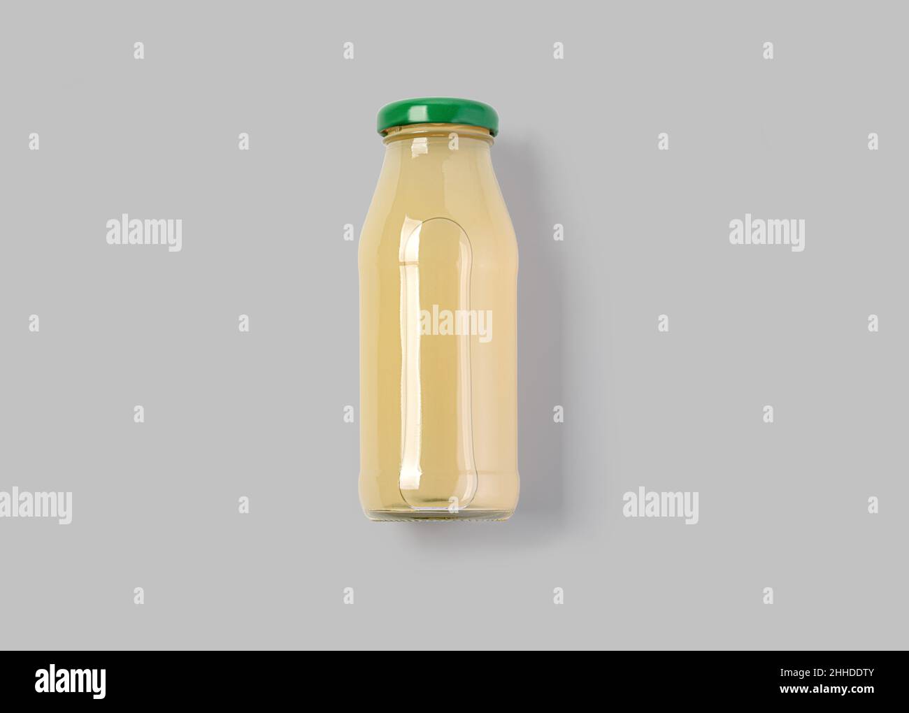 One bottle with tasty drink on grey color background, top view with ...